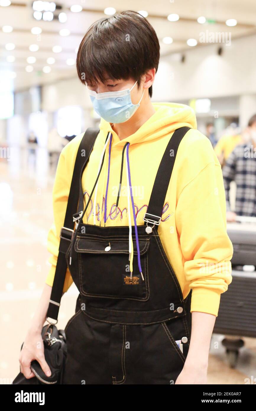 Chinese singer and actor Chen Youwei arrives at a Beijing airport ...
