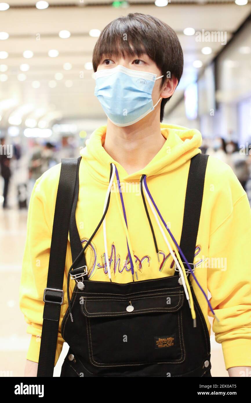 Chinese singer and actor Chen Youwei arrives at a Beijing airport before departure in Beijing ...