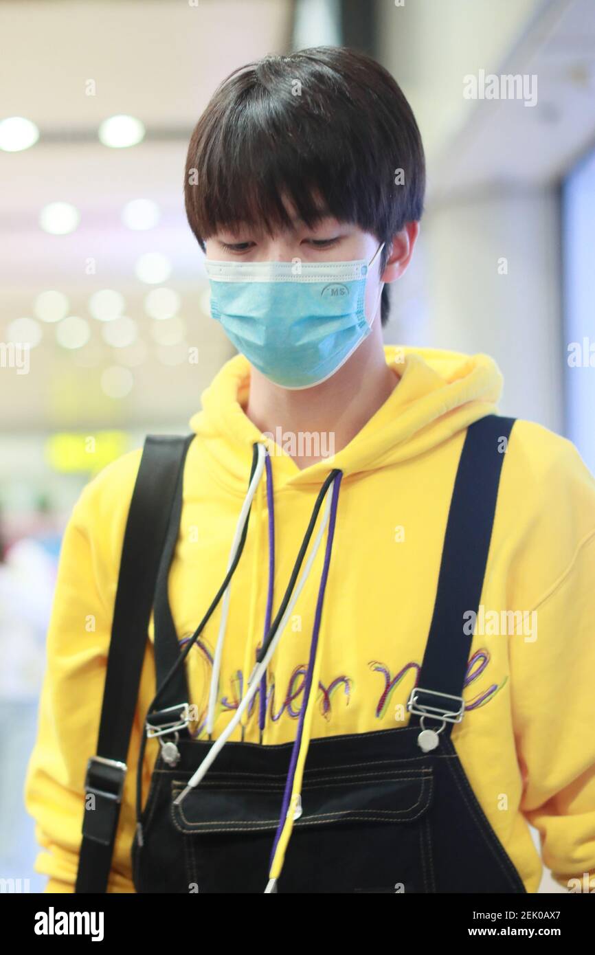 Chinese singer and actor Chen Youwei arrives at a Beijing airport before departure in Beijing ...