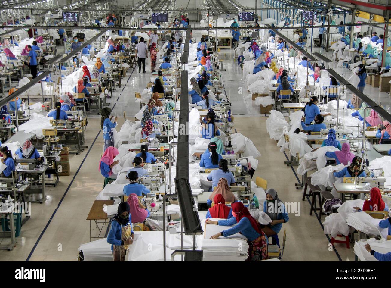 Workers make Personal Protective Equipment for Health Workers during ...