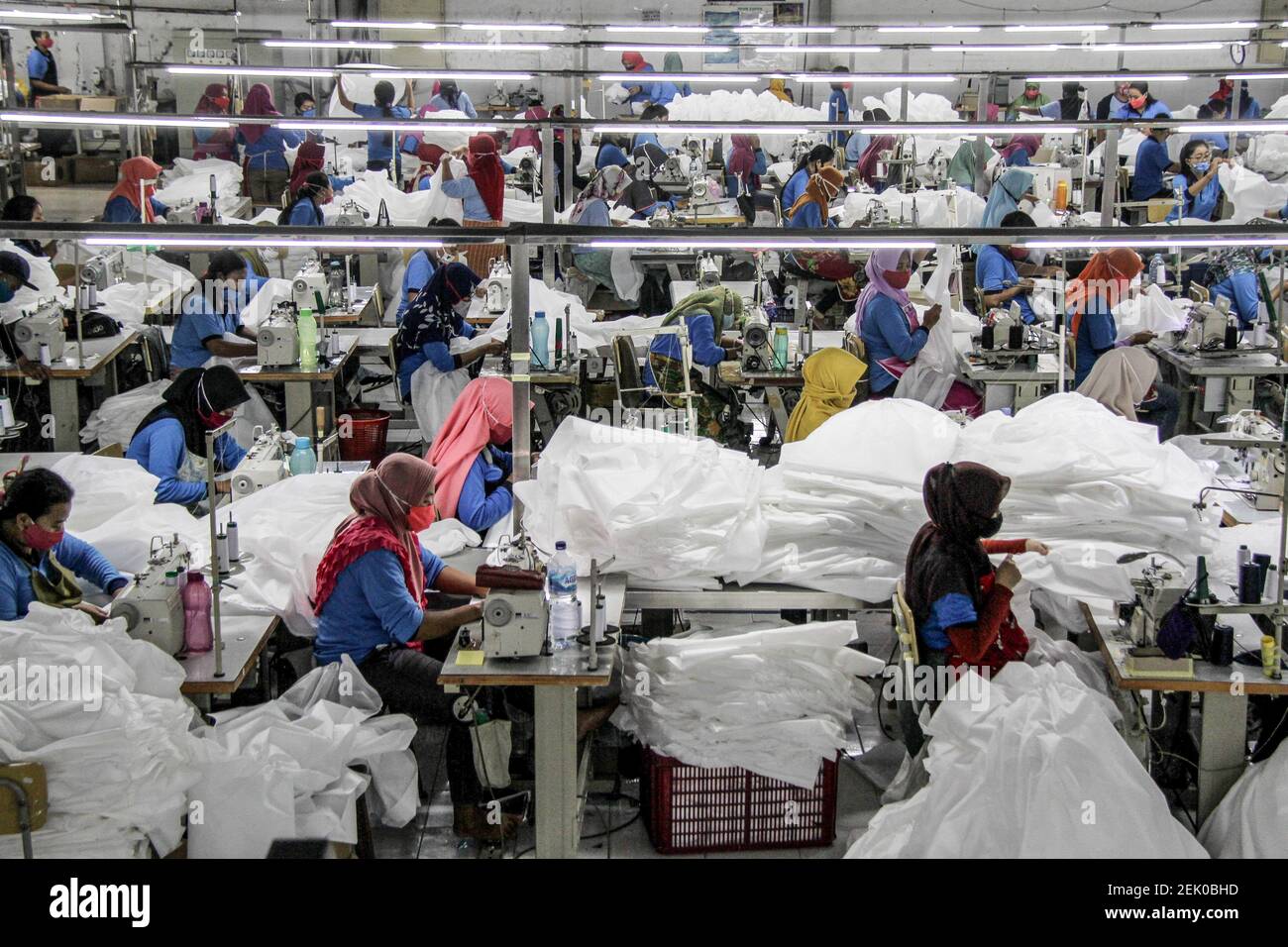 Workers make Personal Protective Equipment for Health Workers during ...