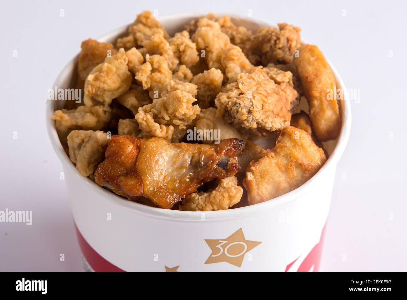 In this unlocated photo, a bucket meal, including chicken nuggets ...