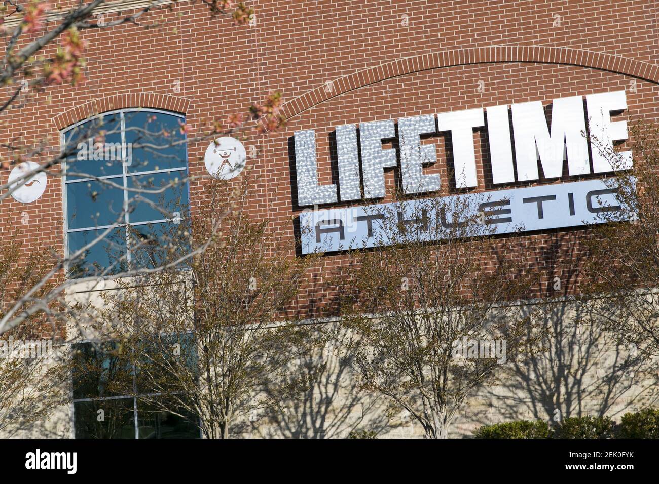 A logo sign outside of a Life Time Athletic fitness center in Columbia ...