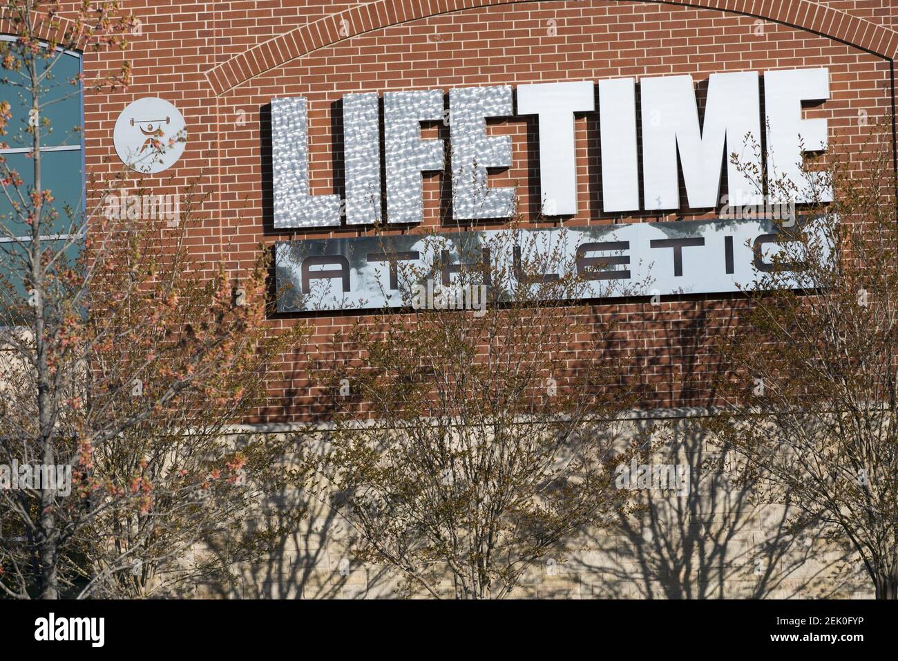 A logo sign outside of a Life Time Athletic fitness center in Columbia ...