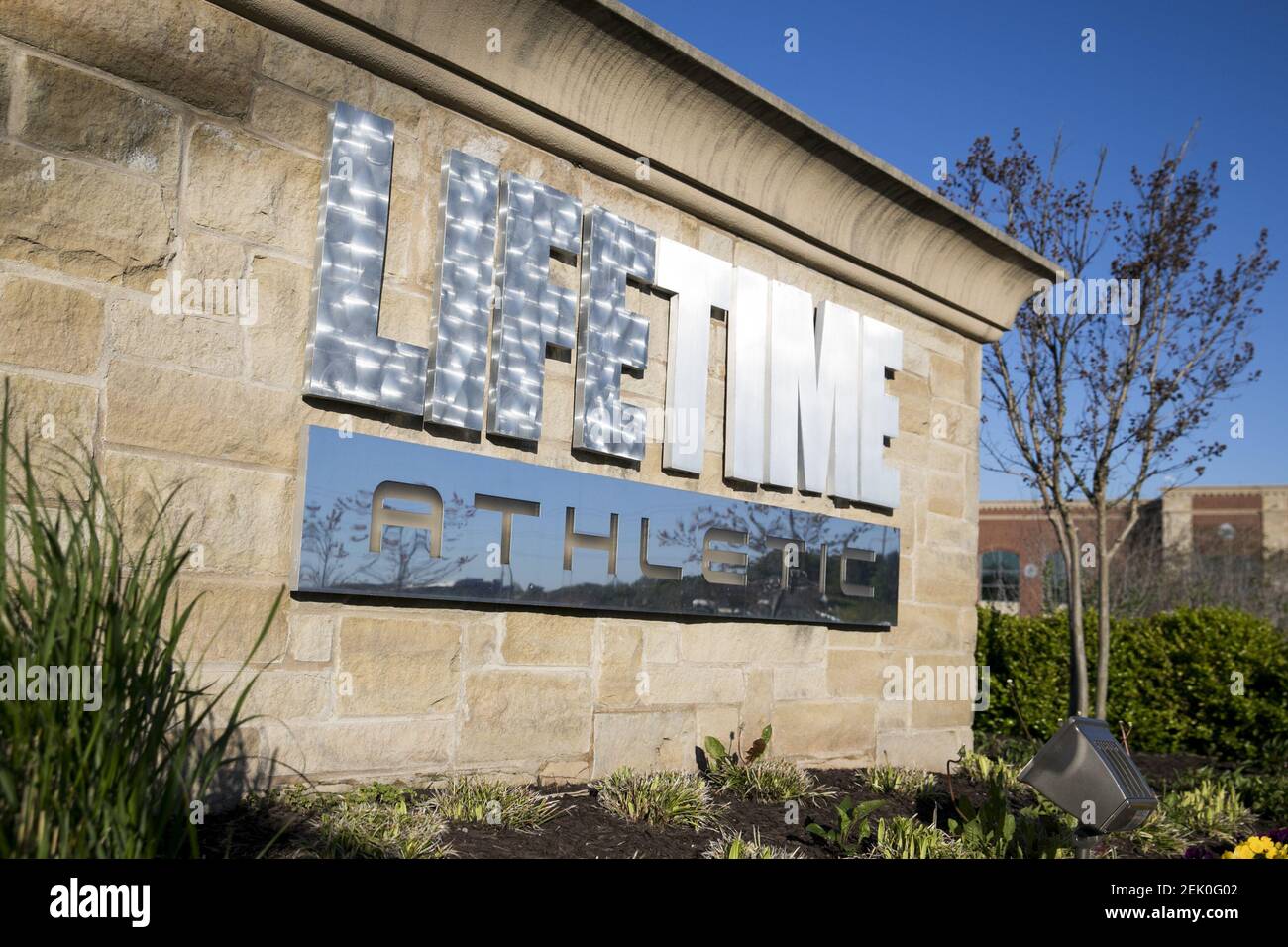 A logo sign outside of a Life Time Athletic fitness center in Columbia ...