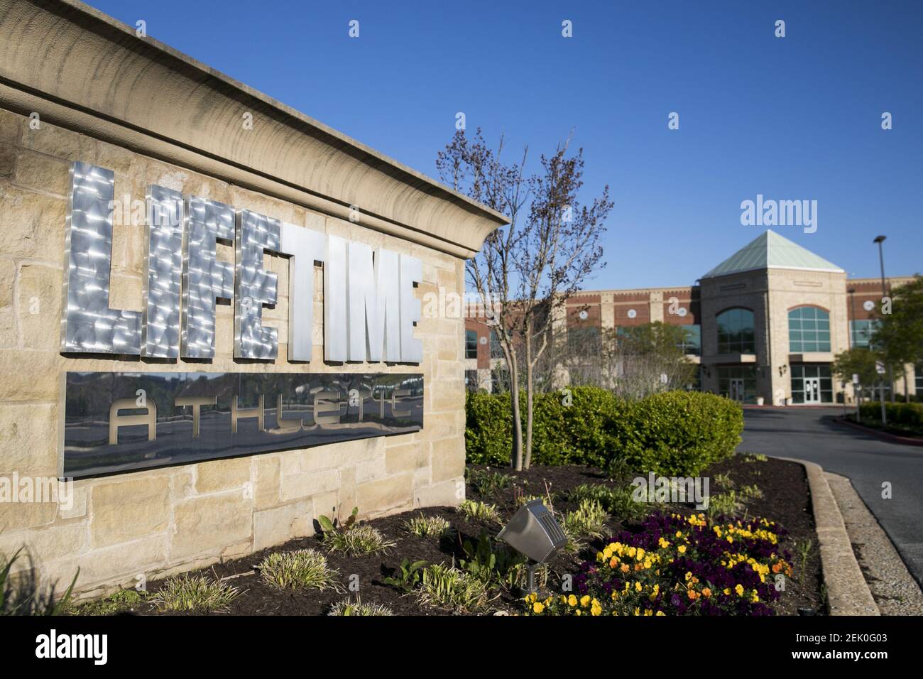 A logo sign outside of a Life Time Athletic fitness center in Columbia ...
