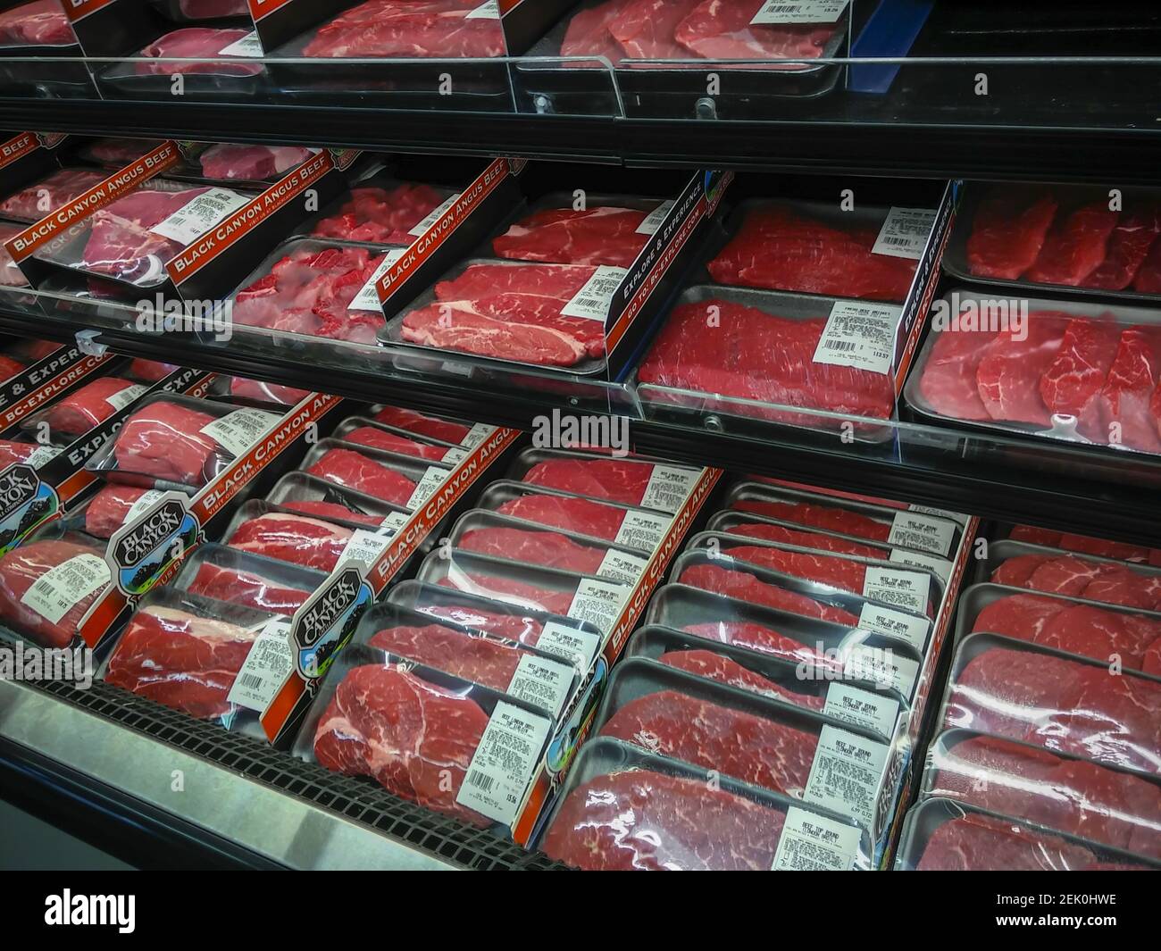 An attractive display of meat in the butcher department of a ...
