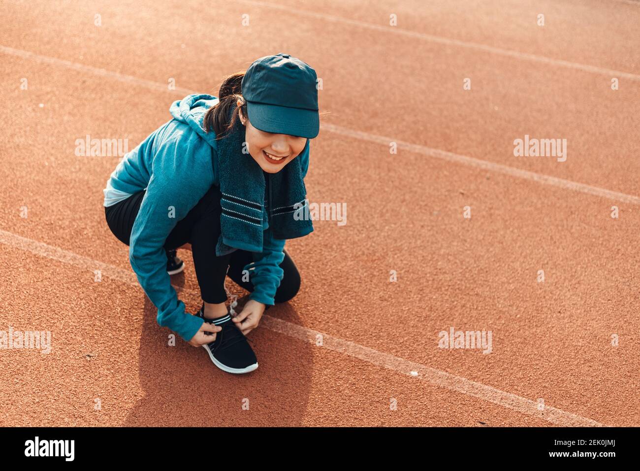 Woman tying shoe laces. Woman fitness runner get ready for jogging on ...