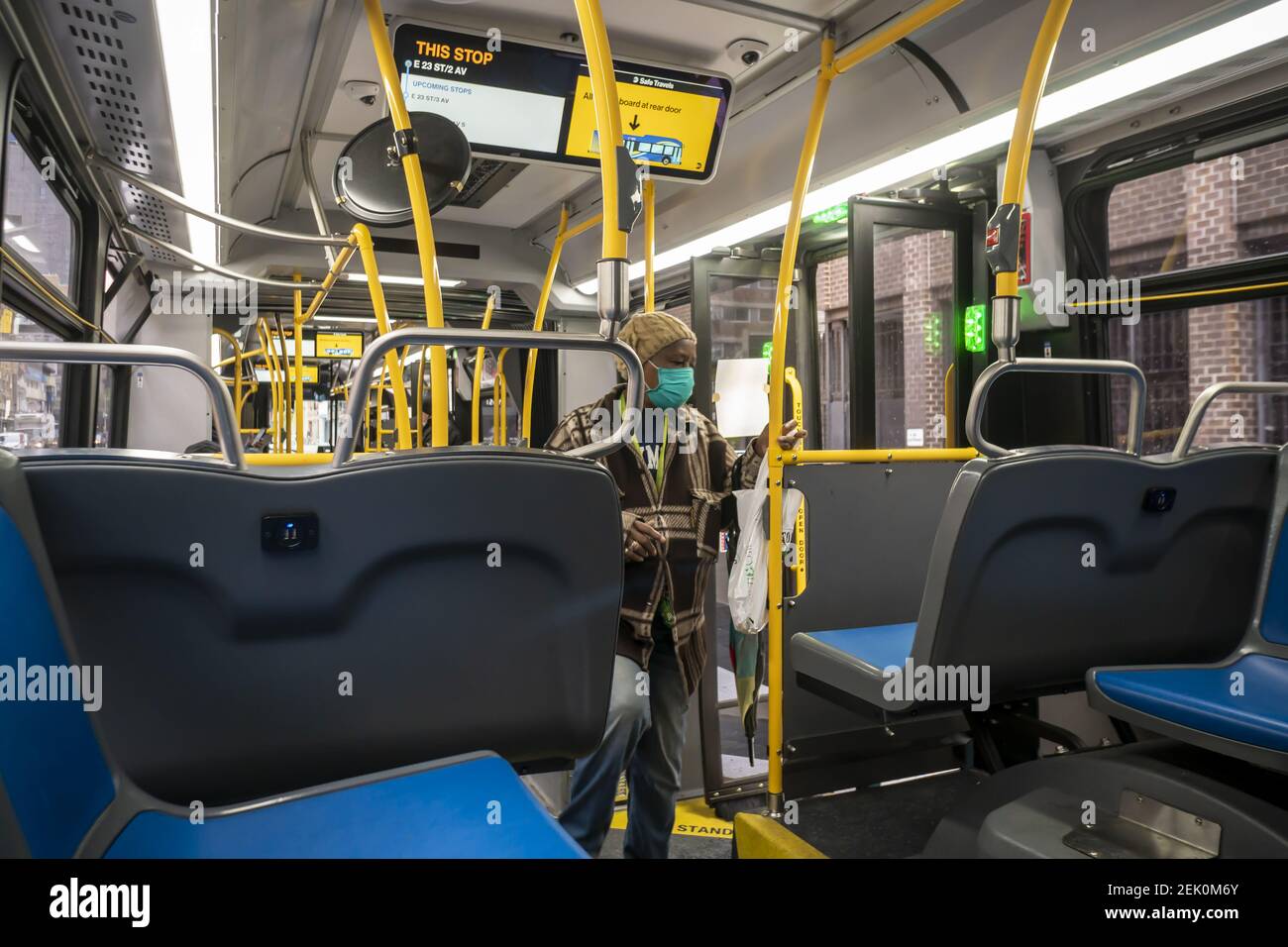 Masked riders in the SBS 23 bus on 23rd street in New York on Friday ...