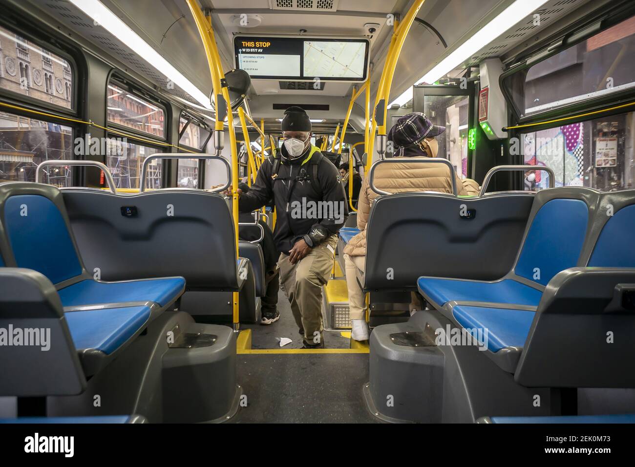 Masked riders in the SBS 23 bus on 23rd street in New York on Friday ...