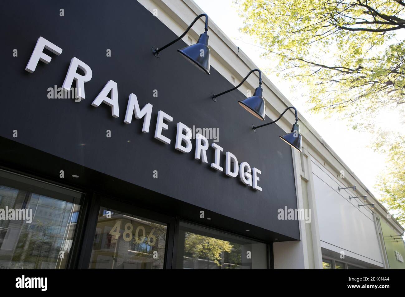 A logo sign outside of a Framebridge retail store location in Bethesda ...