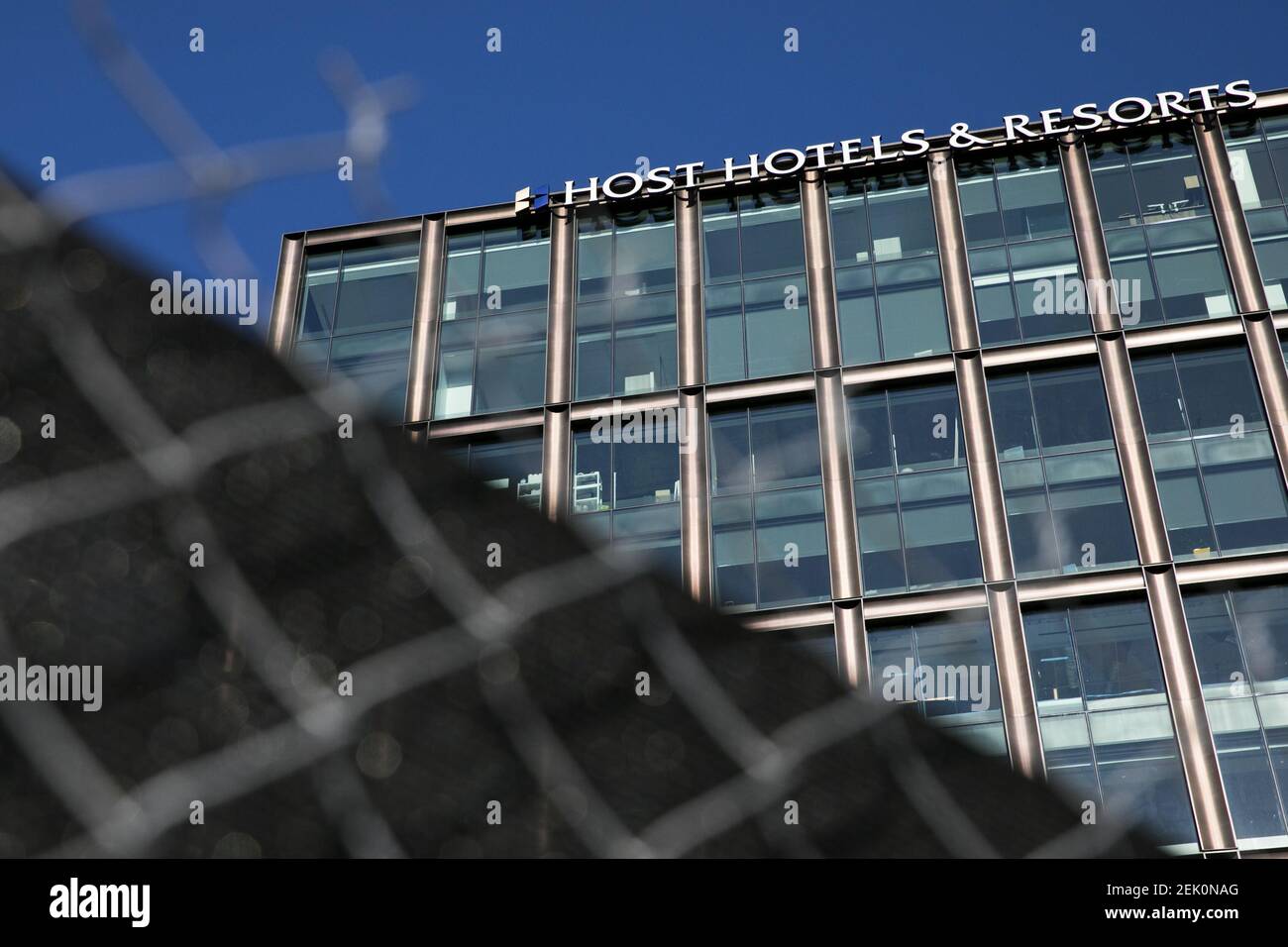 A logo sign outside of the headquarters of Host Hotels & Resorts in ...