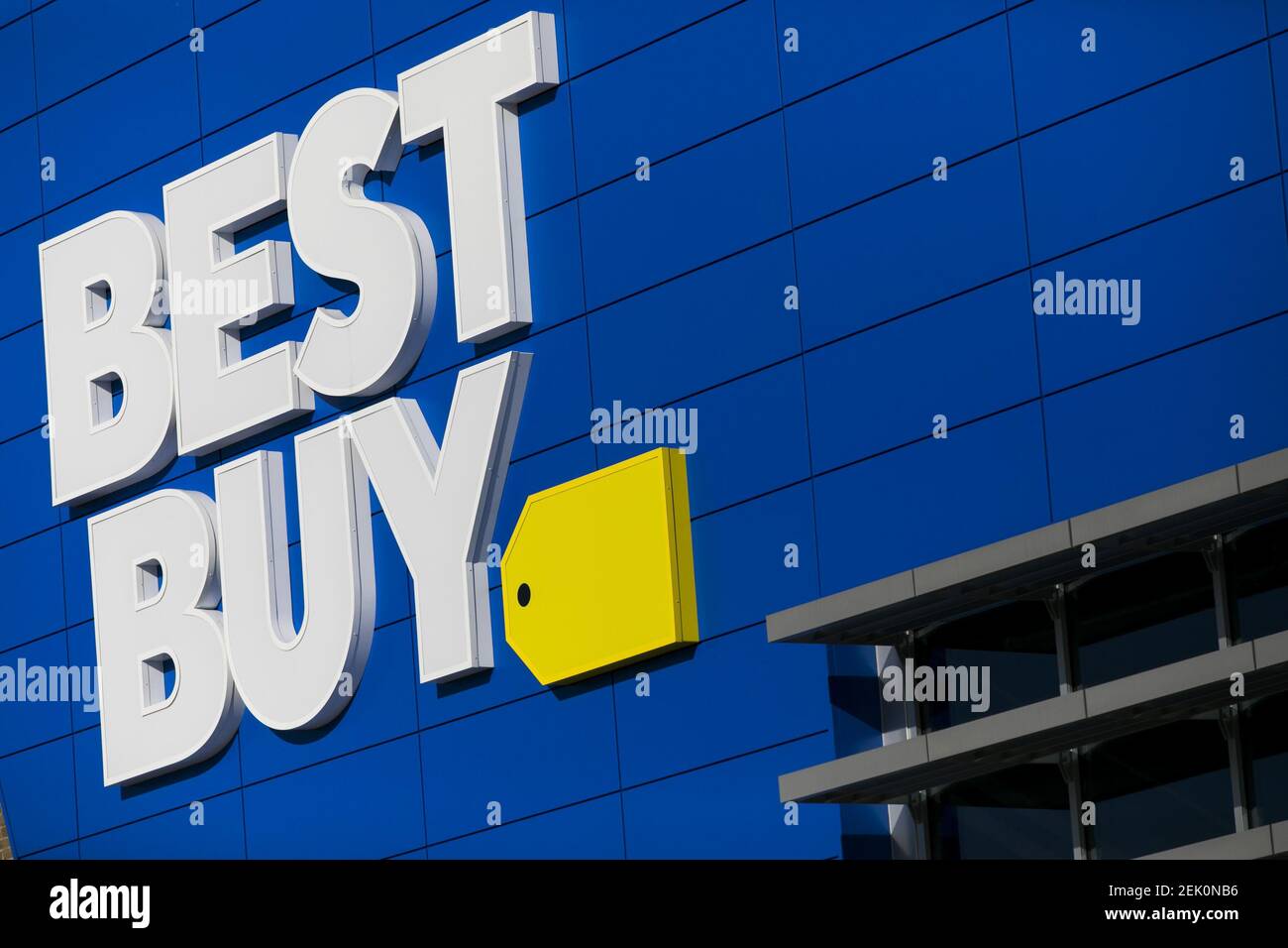 A logo sign outside of a Best Buy retail store location in Laurel ...