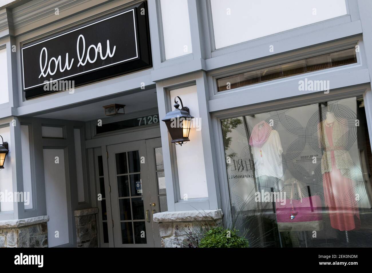 A logo sign outside of a Lou Lou retail store location in Bethesda ...