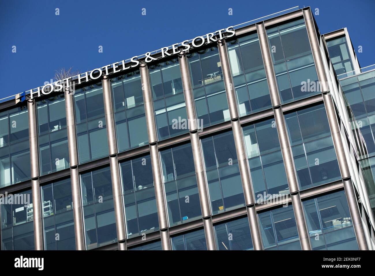 A logo sign outside of the headquarters of Host Hotels & Resorts in ...