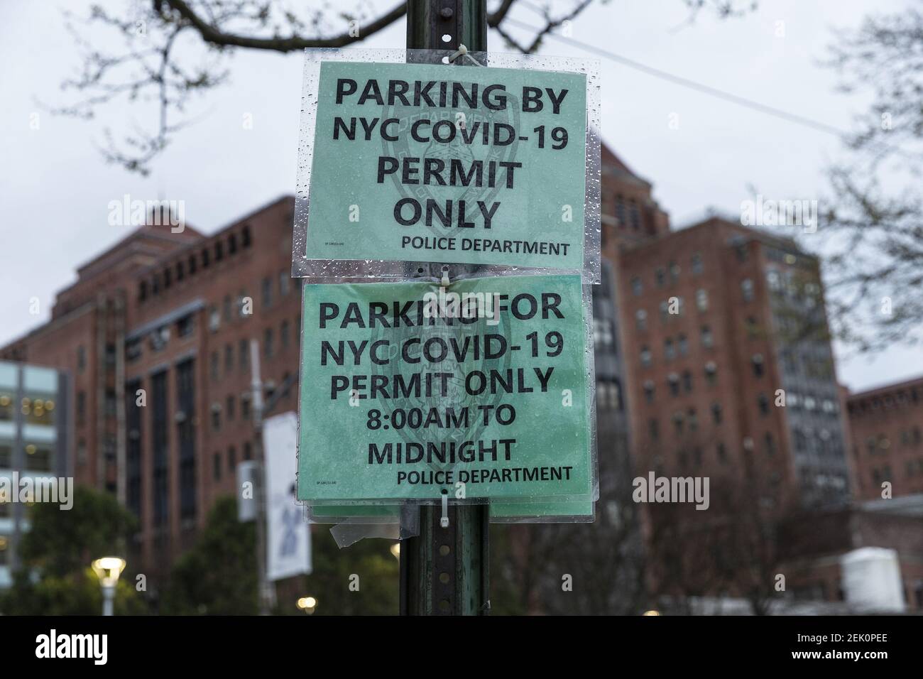 Sign advises that curbside parking by permit only during COVID-19 at ...