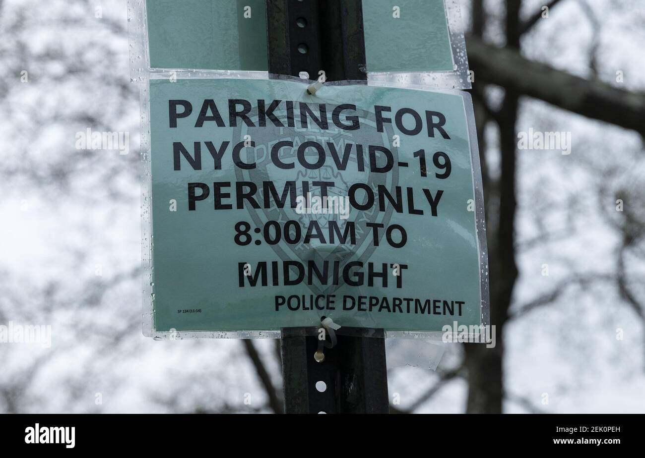 Sign advises that curbside parking by permit only during COVID-19 at ...