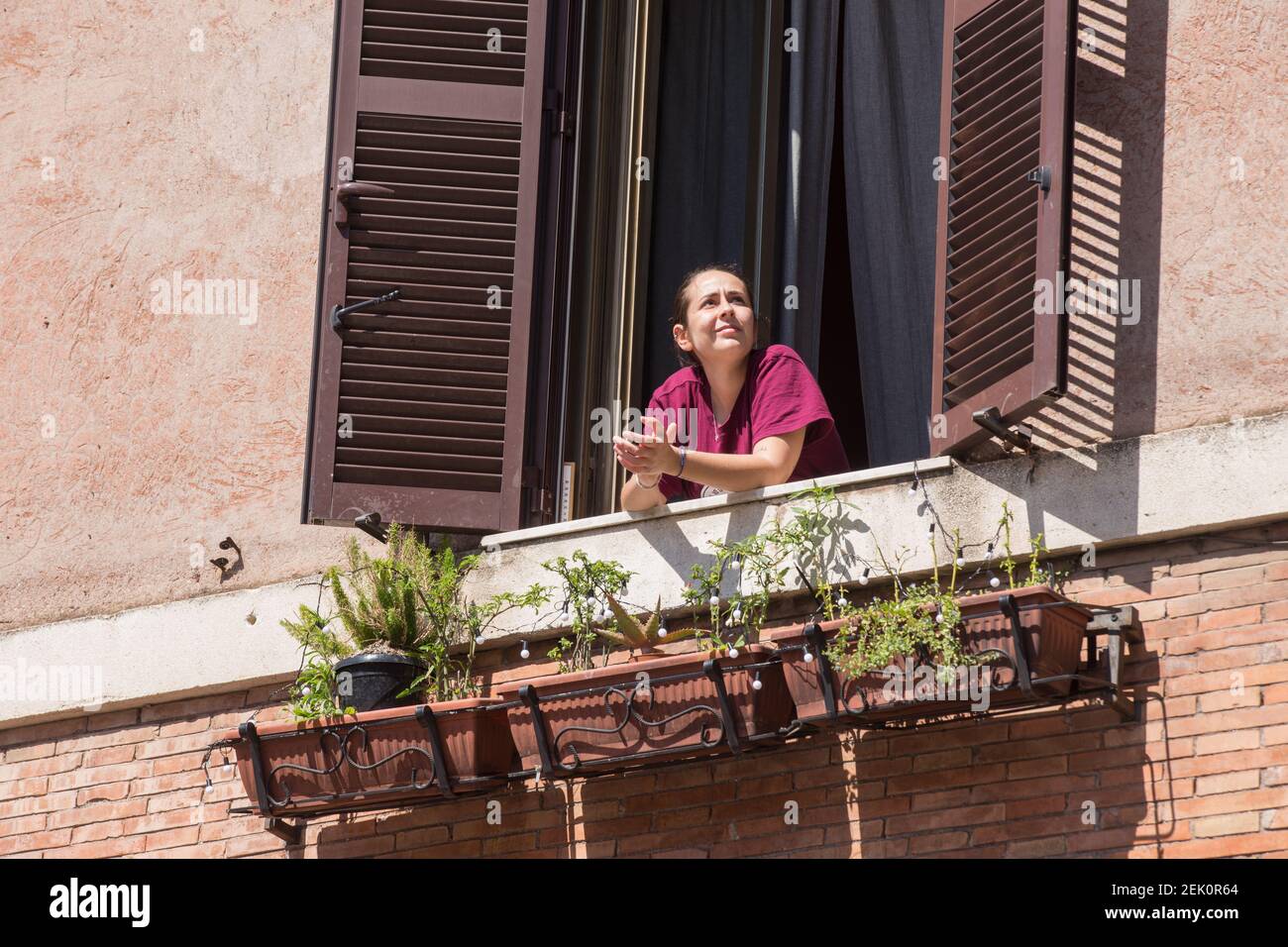 People sing and observing flashmob from windows (Photo by Matteo ...