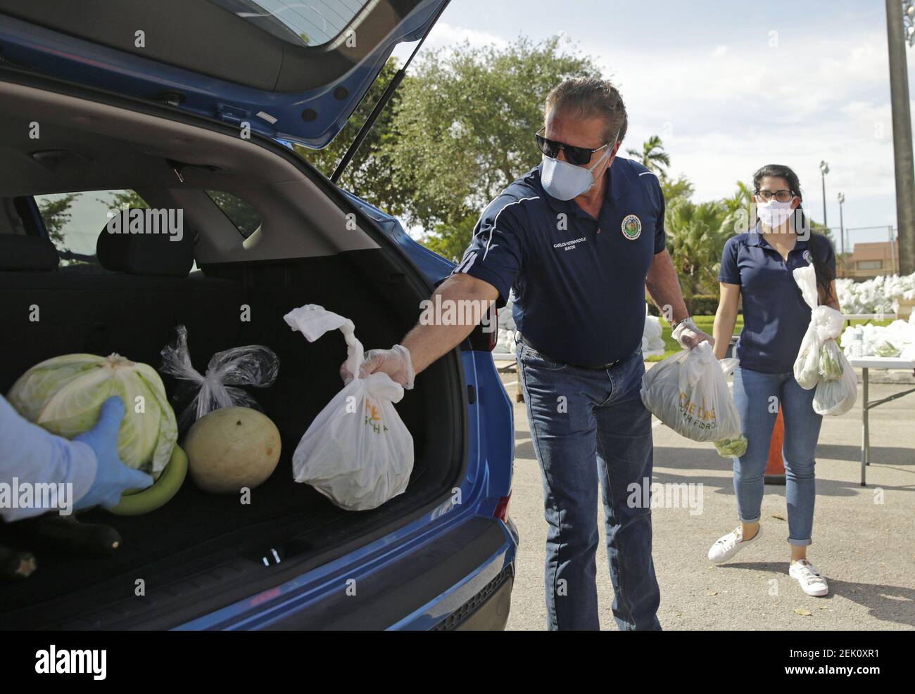 City of Hialeah Mayor Carlos Hernandez loads up food and vegetables ...
