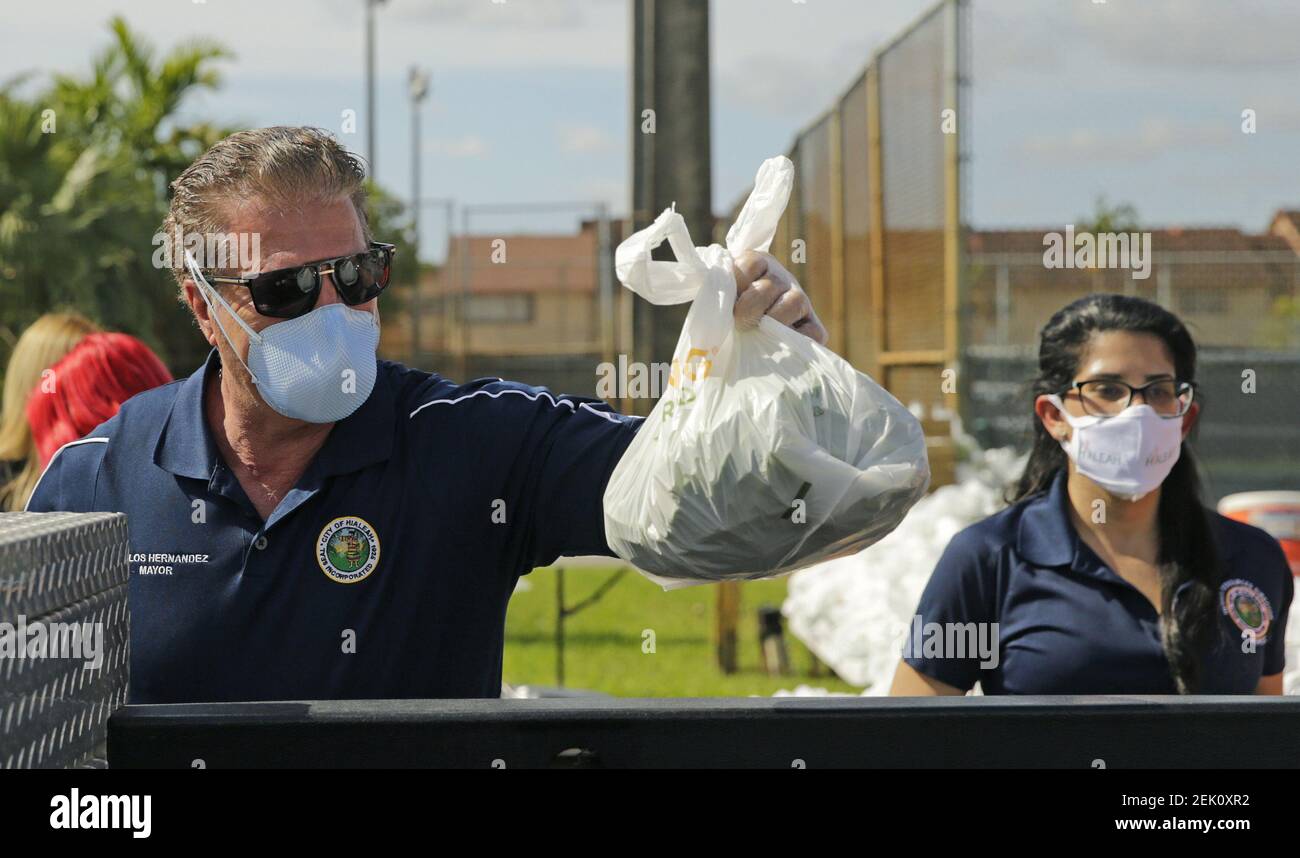 City of Hialeah Mayor Carlos Hernandez loads up food and vegetables ...