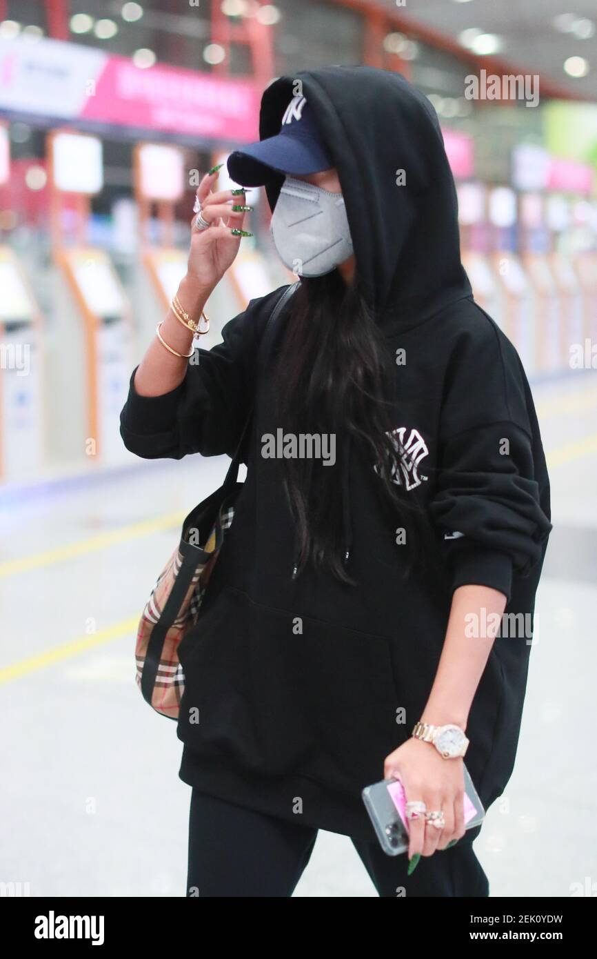 Chinese singer Jike Junyi arrives at a Beijing airport before departure ...