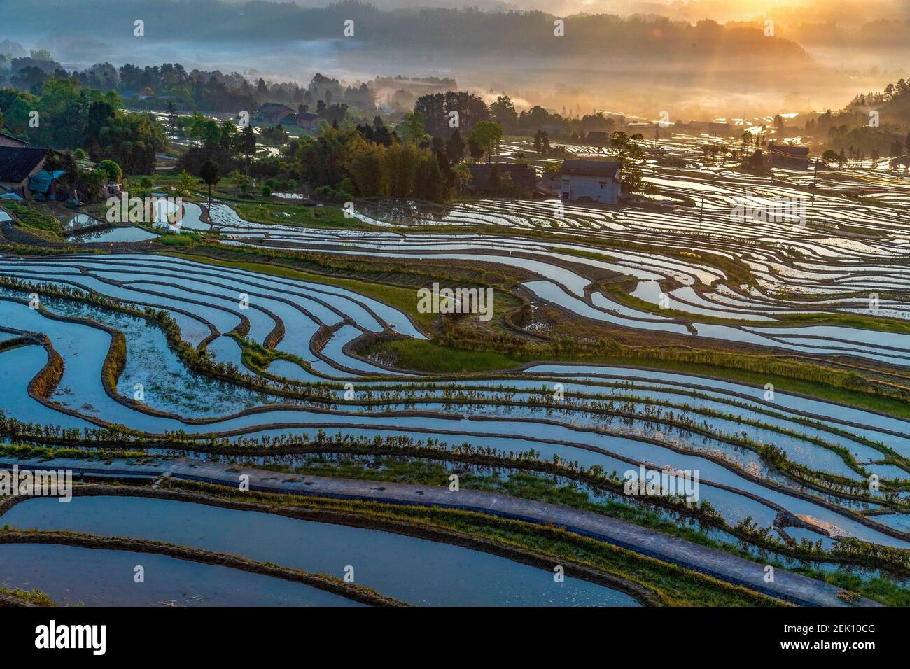An aerial view of terraces on a hill near a small mountain village ...