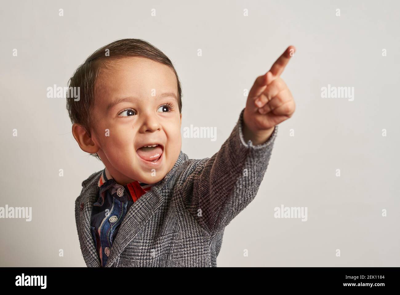 Funny portrait of a 2-years-old boy in a handmade elegant suit. A kid ...