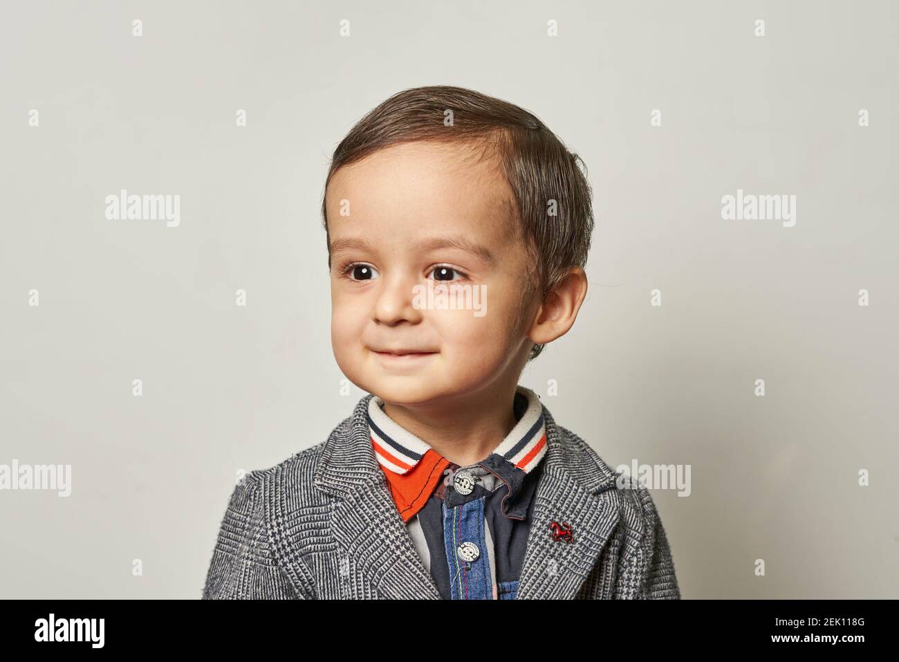 Funny portrait of a 2-years-old boy in a handmade elegant suit. A kid ...