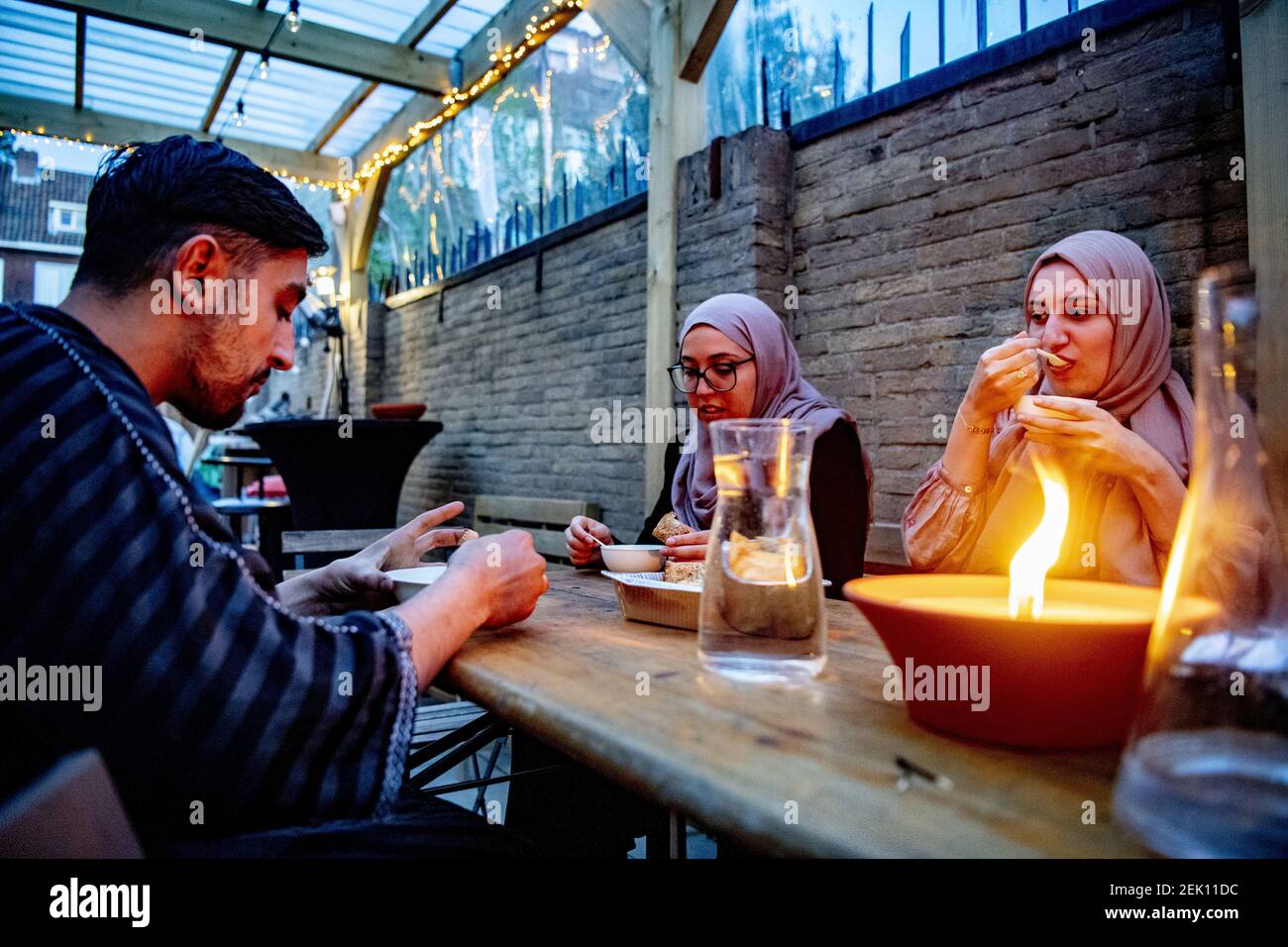 Muslims enjoy the iftar (fast-breaking) dinner during the holy month of ...