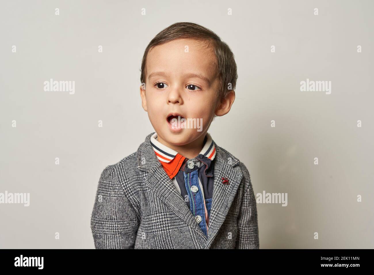 Funny portrait of a 2-years-old boy in a handmade elegant suit. A kid ...