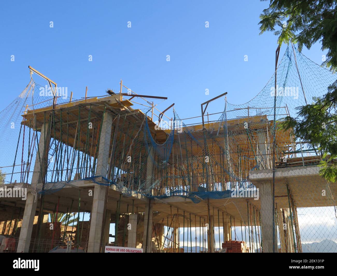 New building site with protective netting cover Stock Photo - Alamy