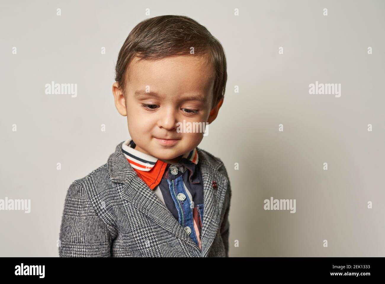 Funny portrait of a 2-years-old boy in a handmade elegant suit. A kid ...