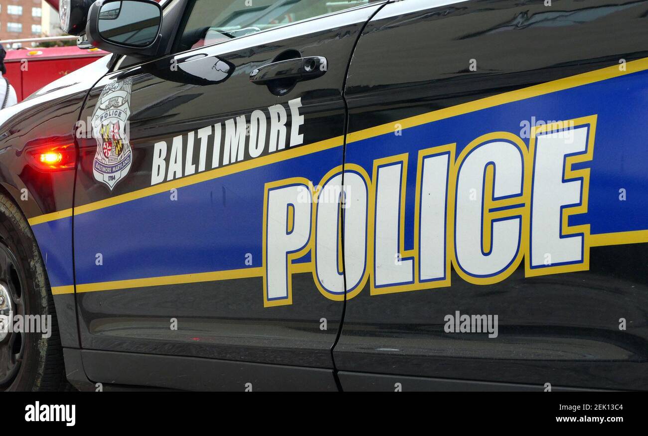 Pictured, a file image of a Baltimore City Police car. Three people ...