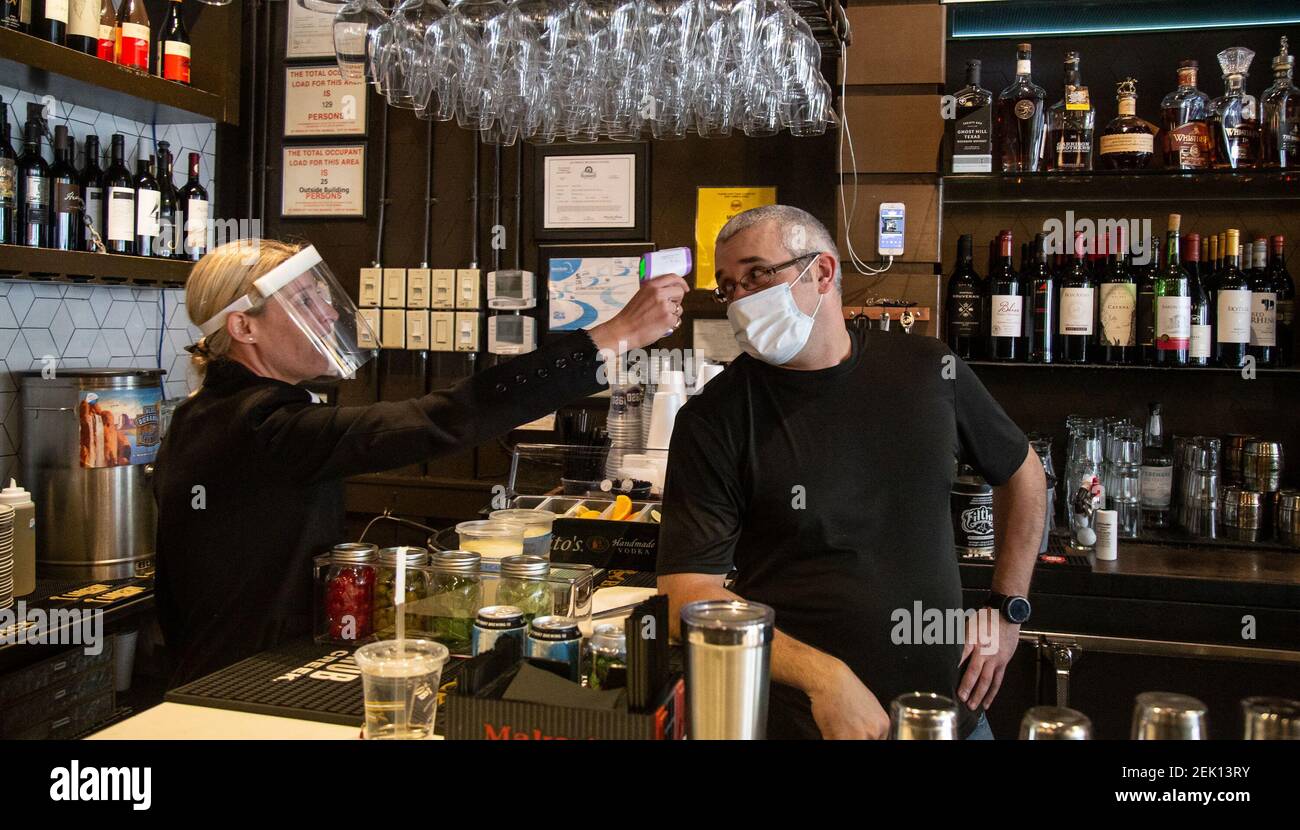 1920 Tavern Owner Jenna Aronowitz takes the temperature of bartender ...