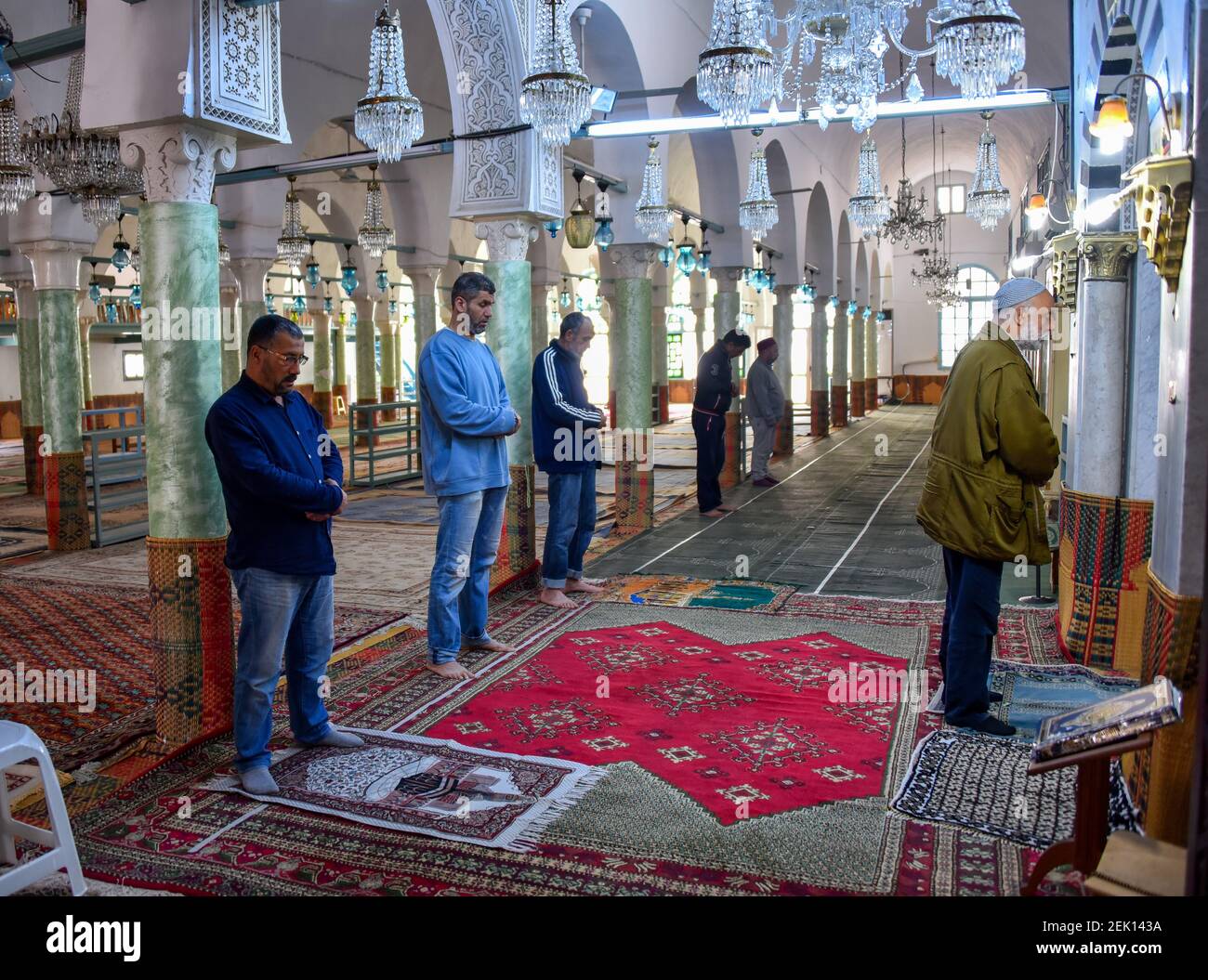 Muslim devotees taking part in Ramadan afternoon prayers at a social ...