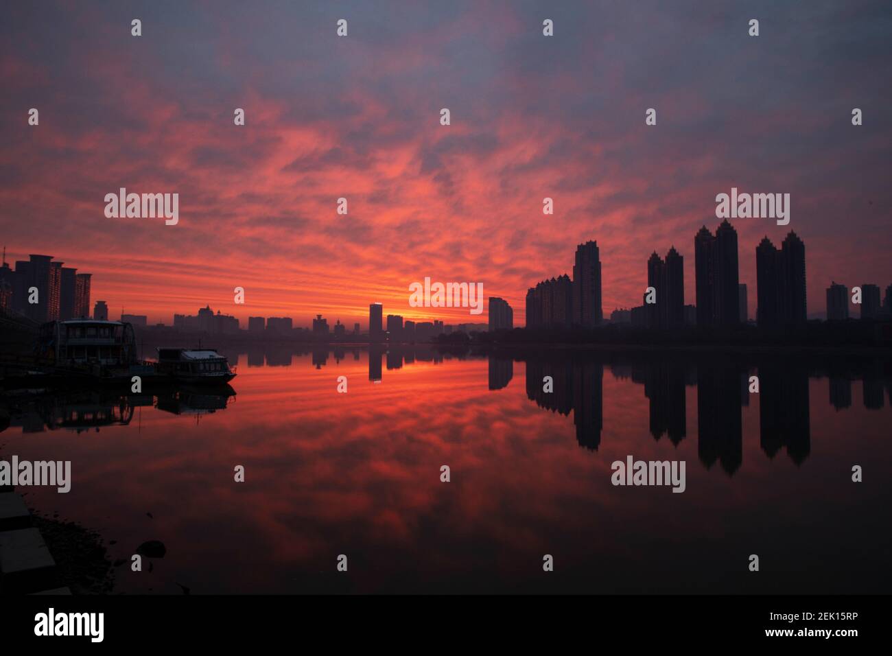 Outline of local skyscrapers across the Songhua River are seen with ...