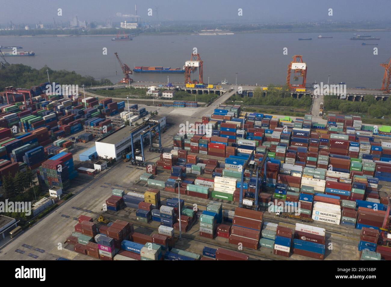 Containers are arrayed waiting to be delivered by cargo vessels at a ...