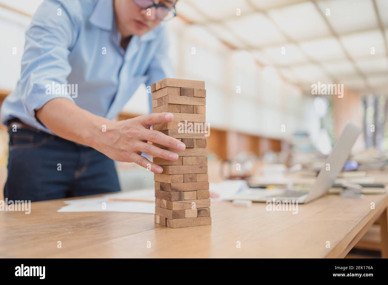 Abstract businessmen fail danger tower block game building construction ...