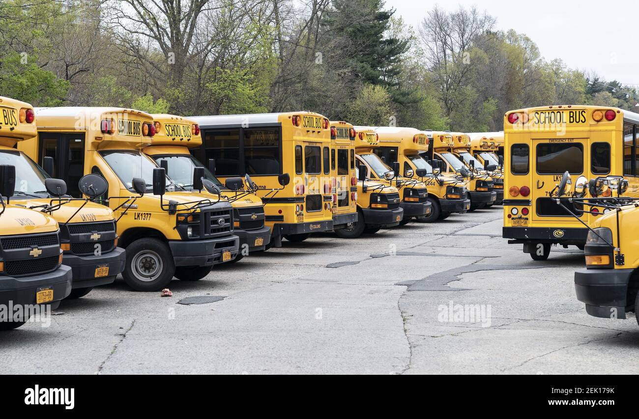 School buses stand idle on the parking lot of the Bronx borough during ...