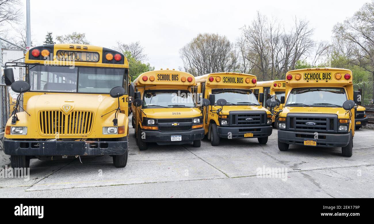 School buses stand idle on the parking lot of the Bronx borough during ...
