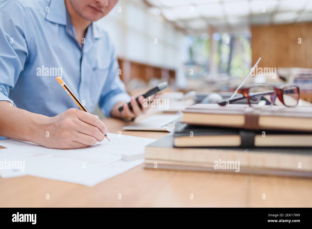 businessman using pencil checking document data calculator for ...
