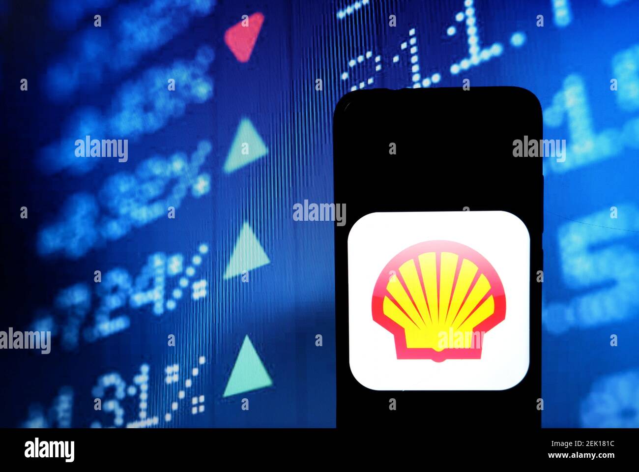 In this photo illustration a Royal Dutch Shell logo seen displayed on a ...