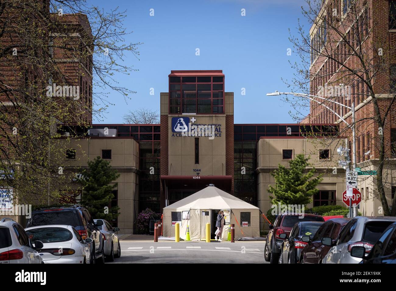 A healthcare worker exits a screening tent at Norwegian American ...
