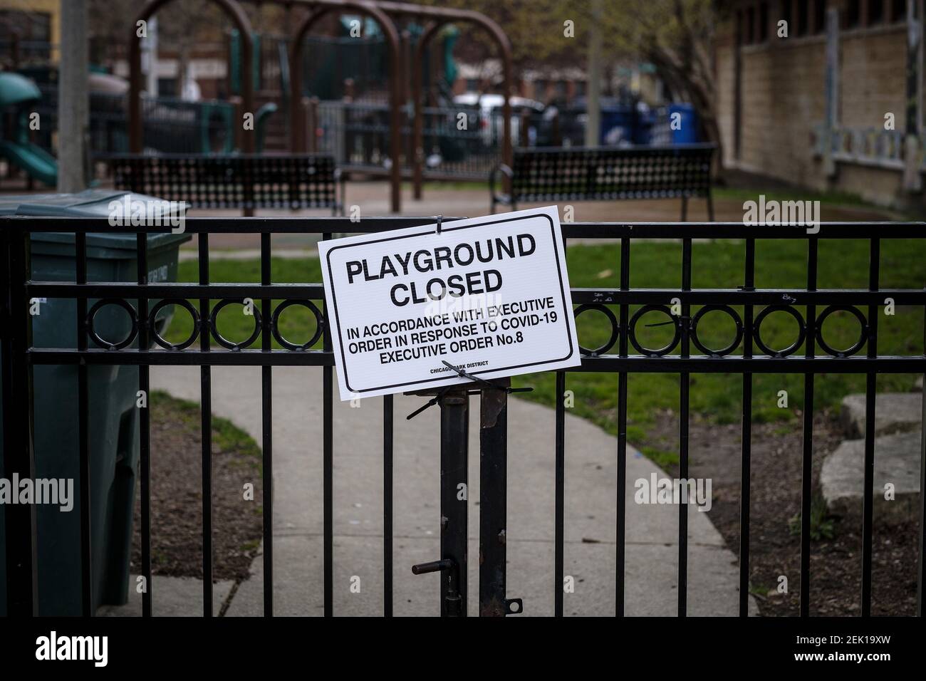 A sign announces the closing of a playground in a public park in ...