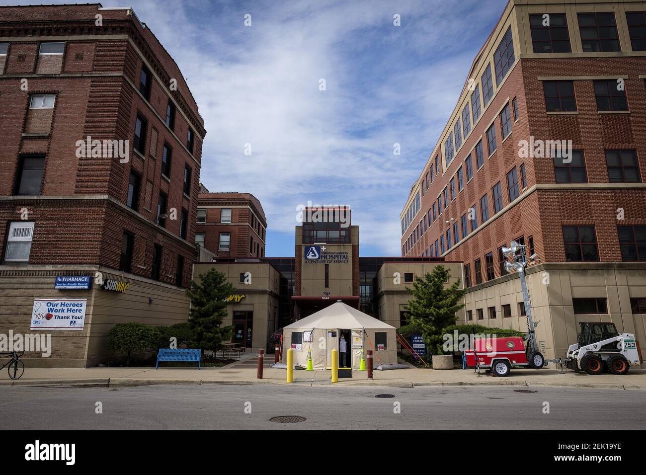 A healthcare worker looks out from a screening tent at Norwegian ...
