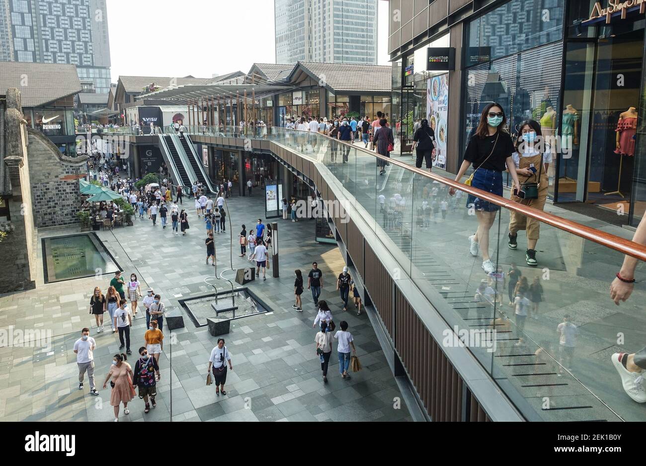 People walk around at Sino-Ocean Taikoo Li, a mixed-use development in ...