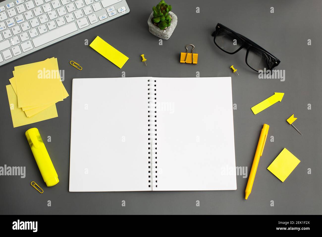 Opened notebook and other office equipment such as computer keyboard ...