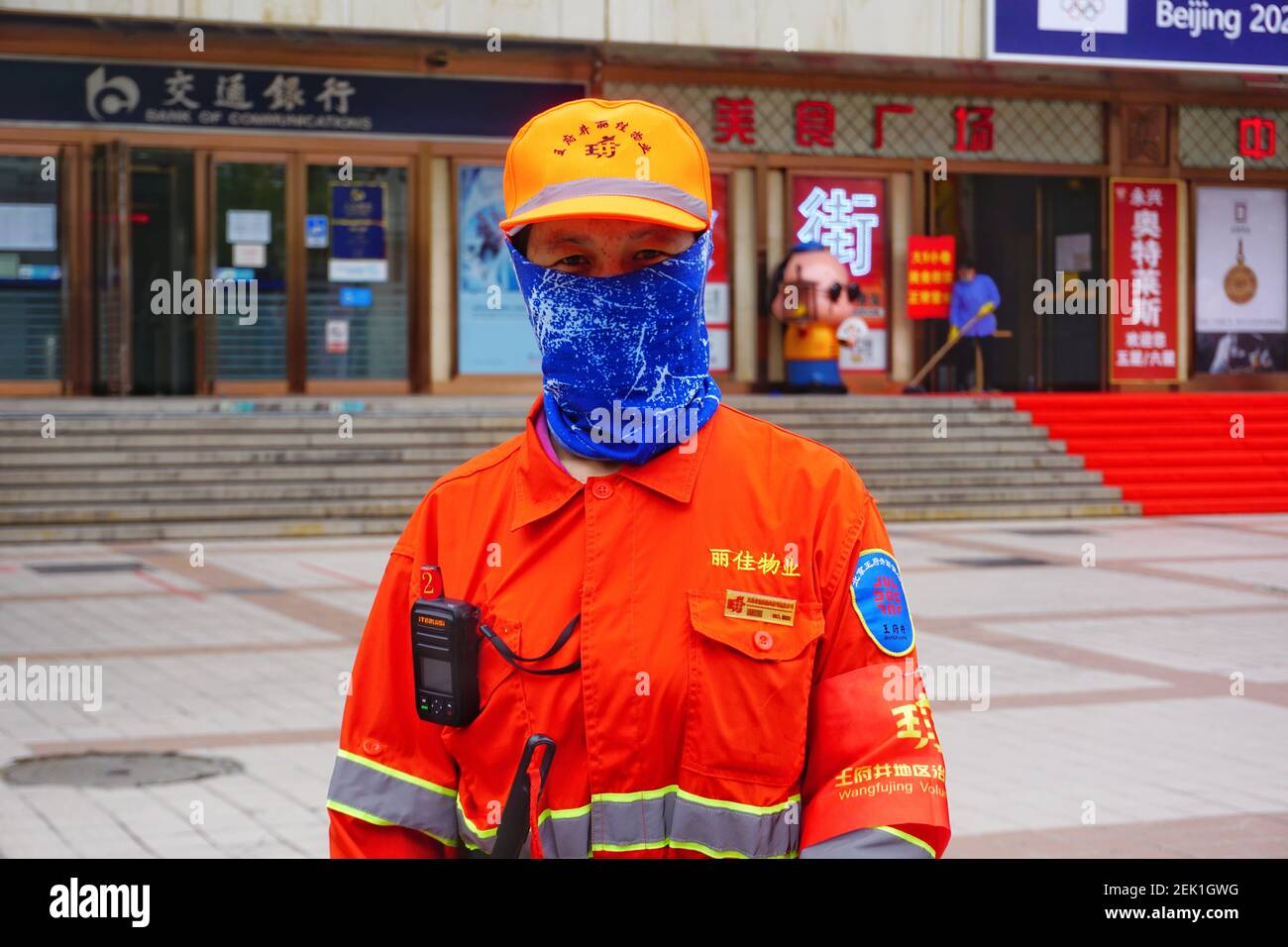Sanitation workers on the Wangfujing Walkway clean the street by using ...