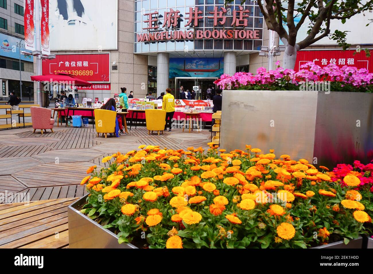 Sanitation workers on the Wangfujing Walkway clean the street by using ...