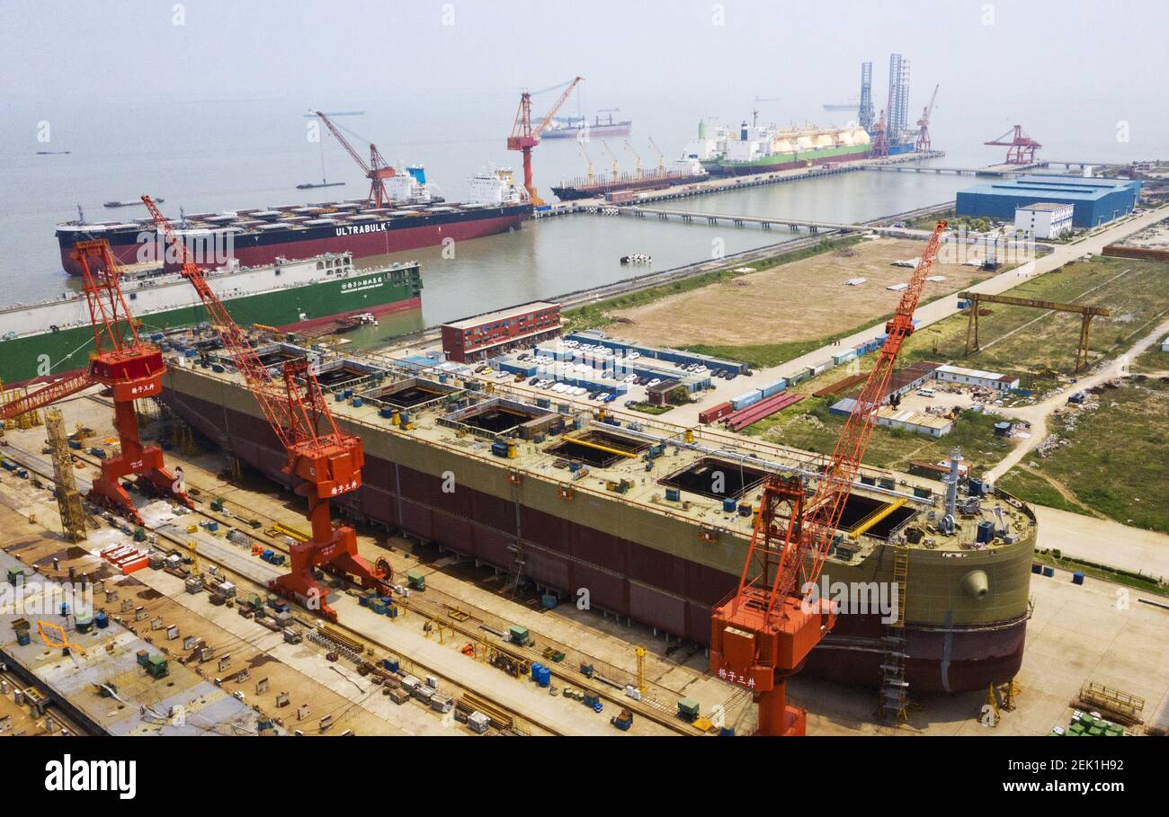 An aerial view of ships under construction at the pier of a local ...